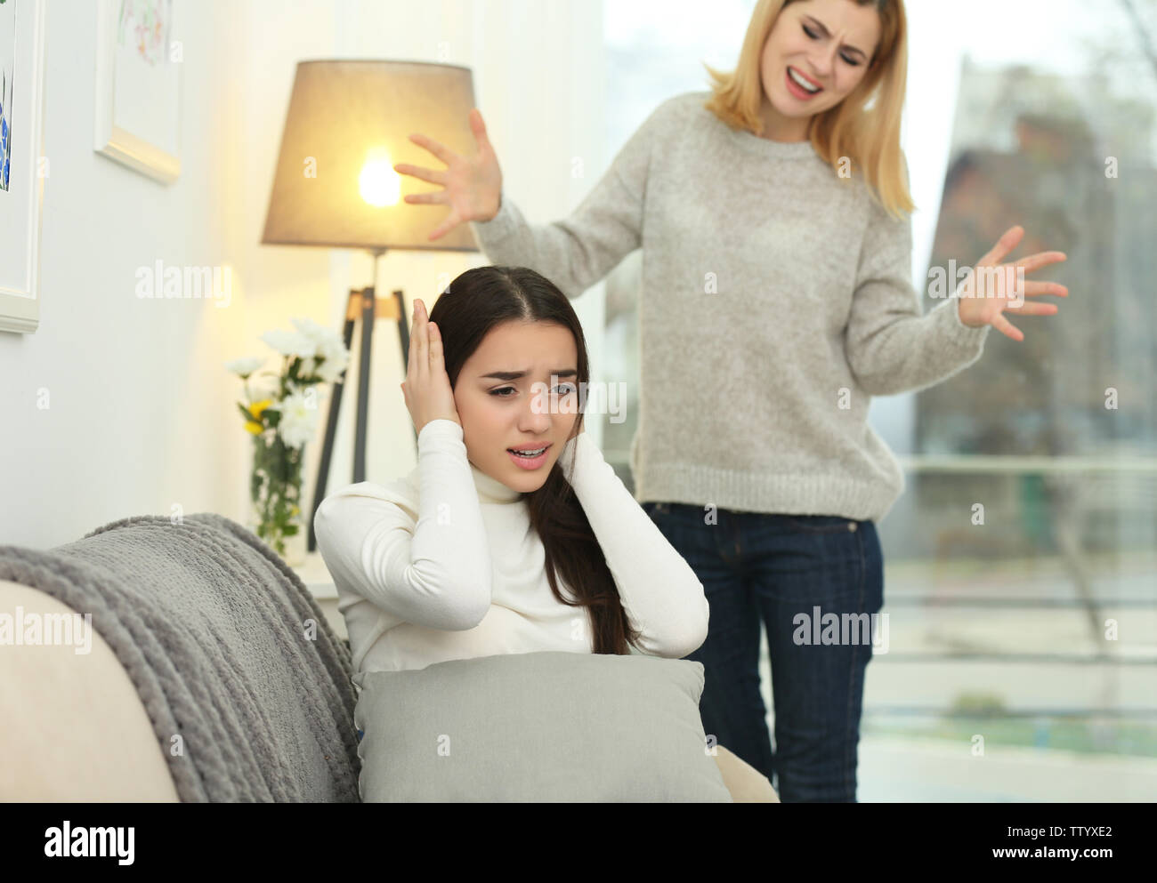 Young woman covering furniture hi-res stock photography and images - Alamy