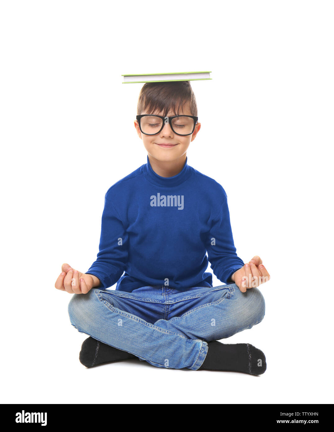 Cute boy meditating on white background Stock Photo - Alamy