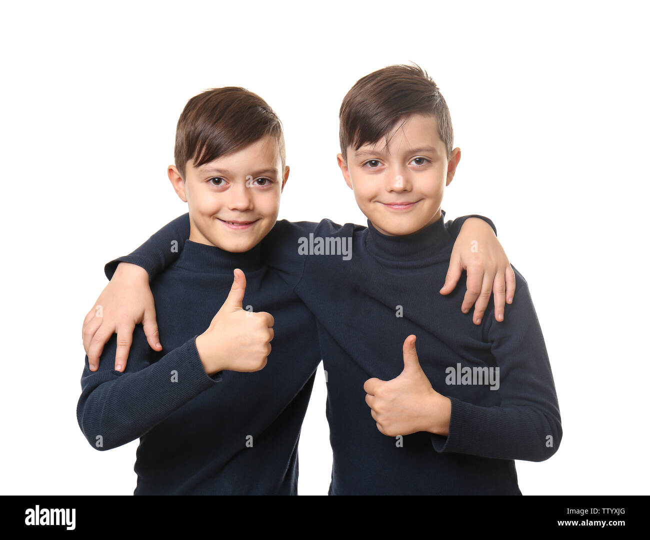 Twin brothers on white background Stock Photo - Alamy