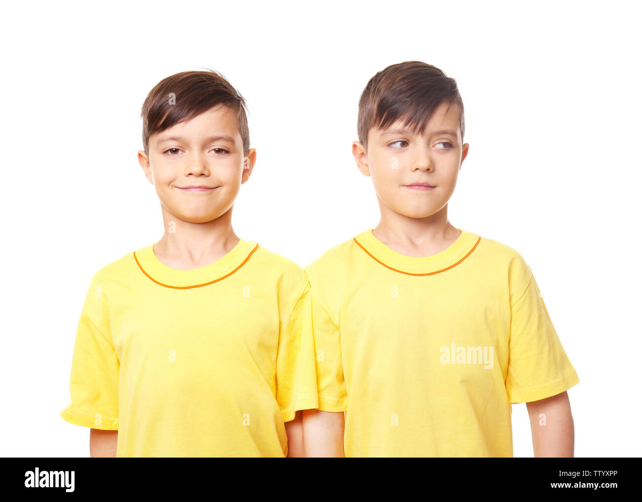 Twin brothers on white background Stock Photo - Alamy