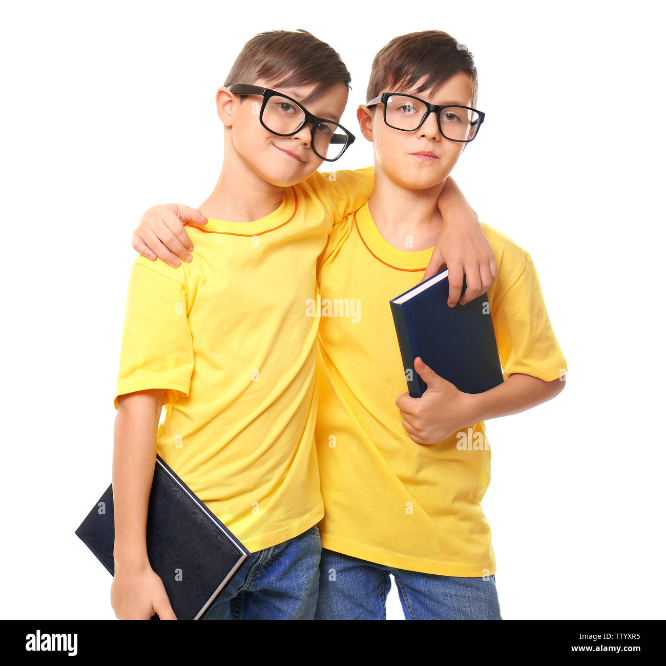 Twin brothers in glasses on white background Stock Photo - Alamy