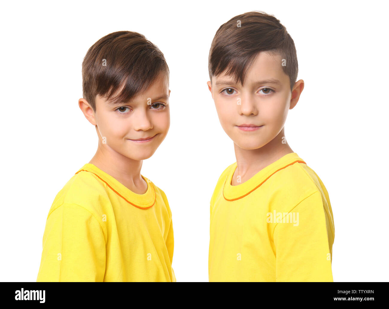 Twin brothers on white background Stock Photo - Alamy