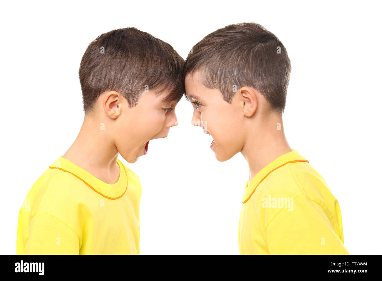 Twin brothers on white background Stock Photo - Alamy