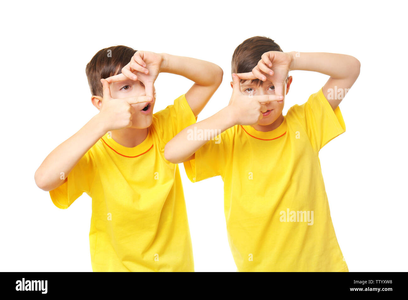 Twin brothers on white background Stock Photo - Alamy