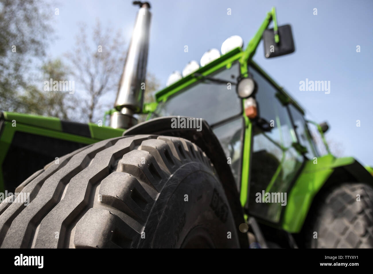 a plain modern green tractor Stock Photo - Alamy