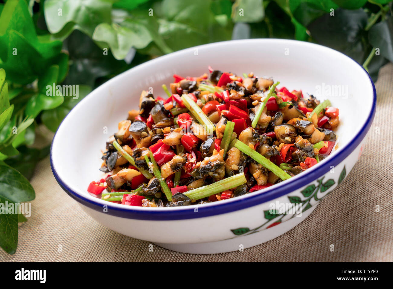 Stir-fried snail meat Stock Photo - Alamy