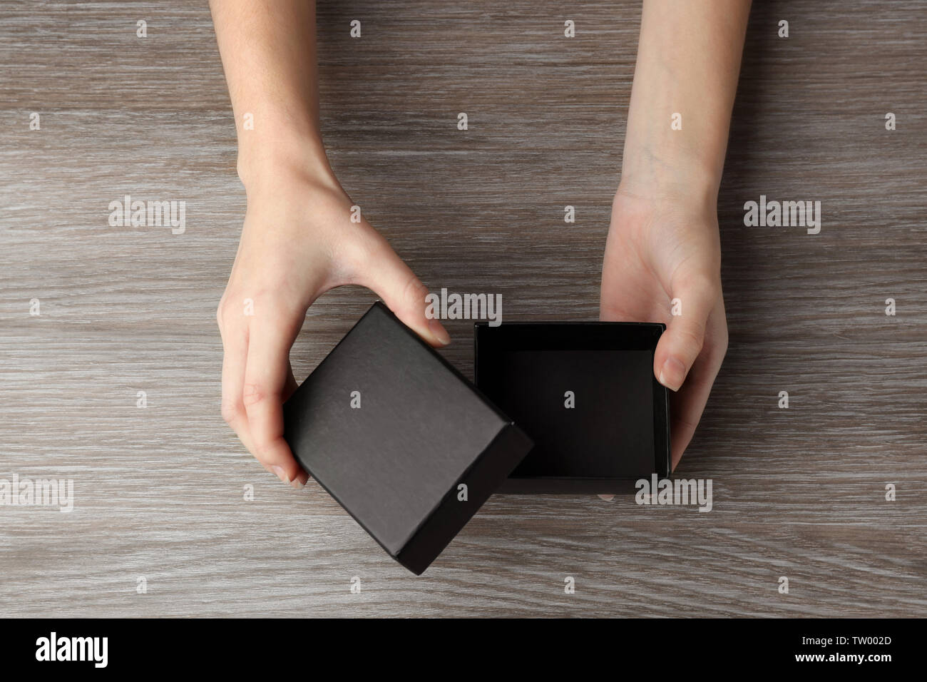 Female hands opening black hi-res stock photography and images - Alamy