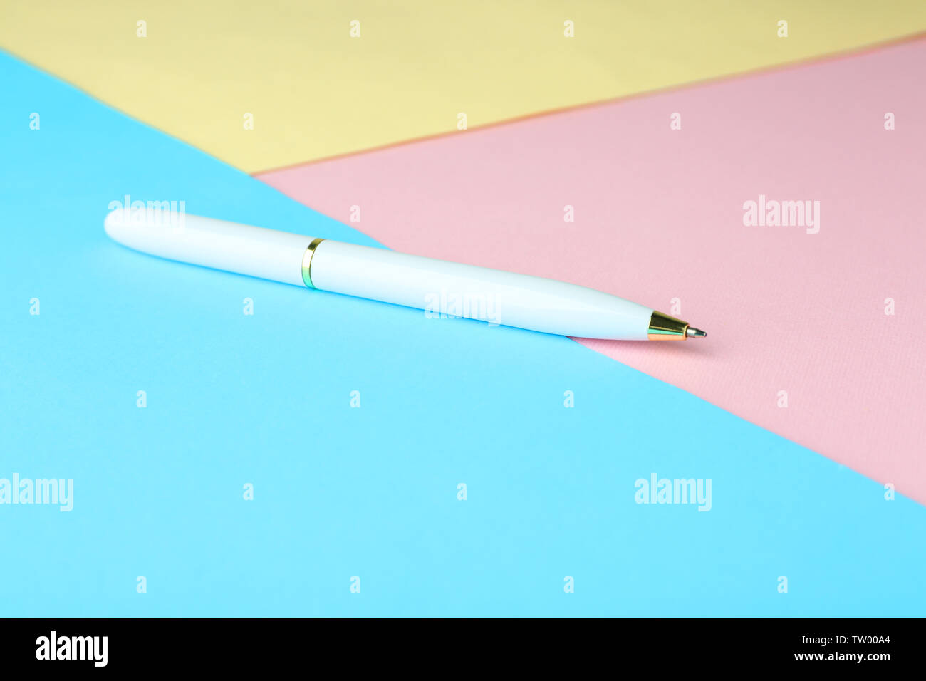 Blank ballpoint pen on color paper background Stock Photo - Alamy