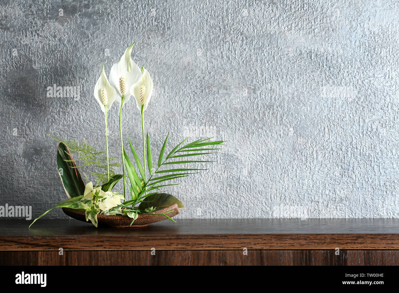 Flower arrangement on a color background Stock Photo - Alamy
