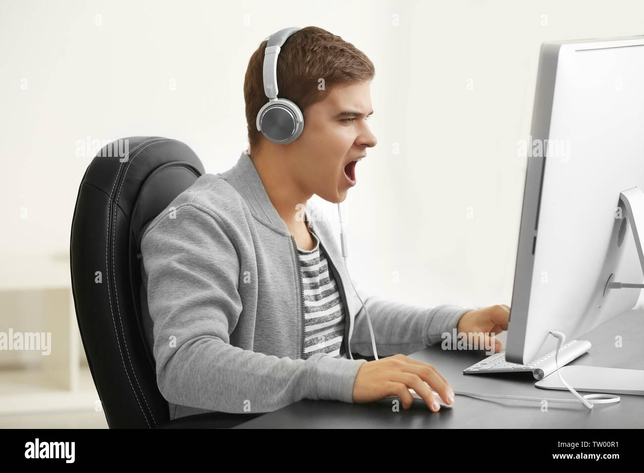 Teenager playing computer game at home Stock Photo - Alamy