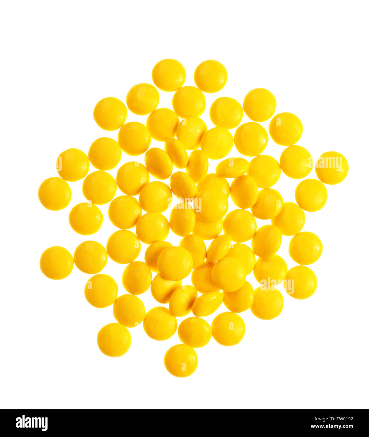 Yellow candies on white background Stock Photo - Alamy