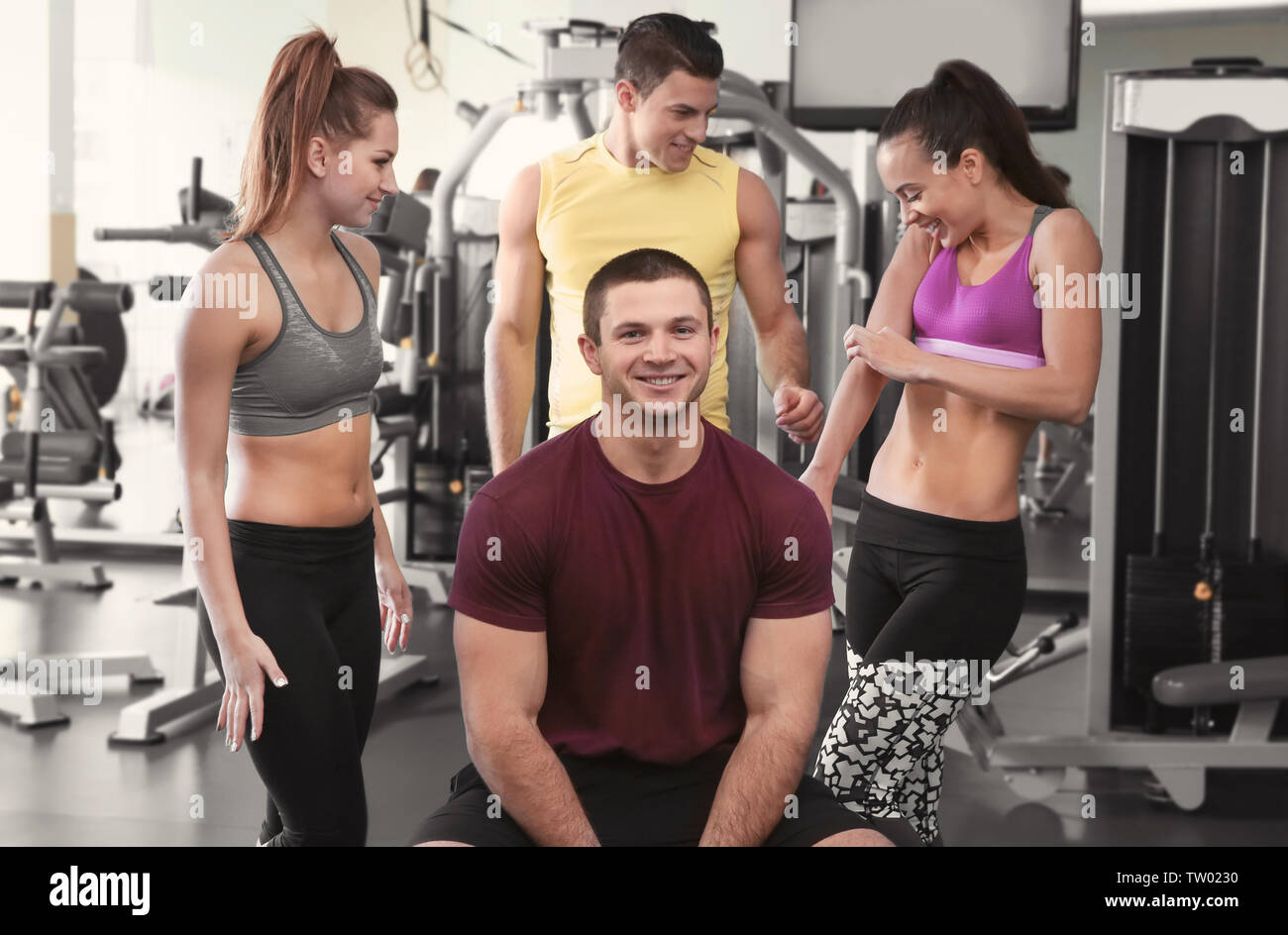 Group of sportive people in gym Stock Photo - Alamy