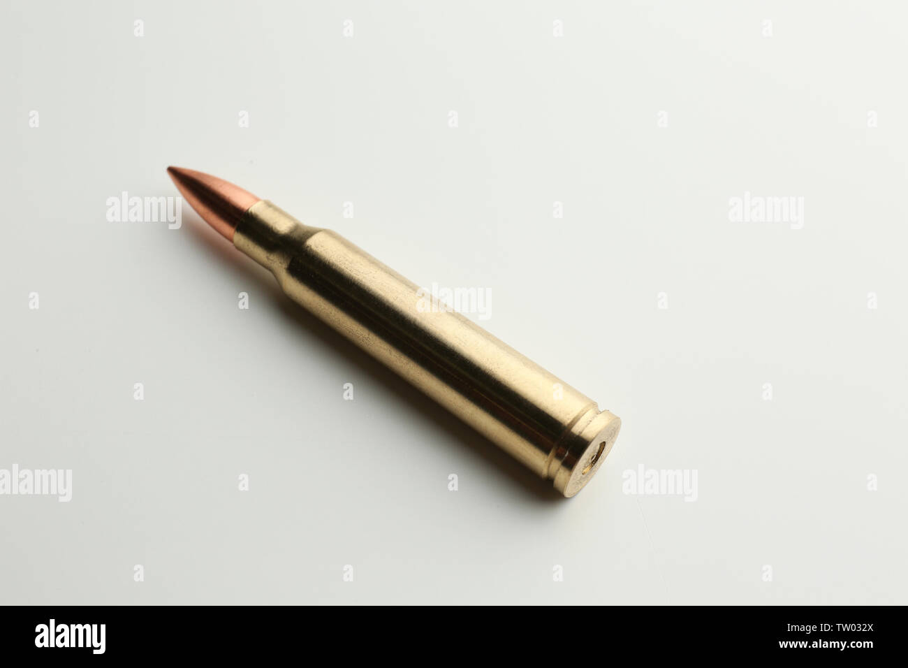 Rifle bullet on white background Stock Photo - Alamy