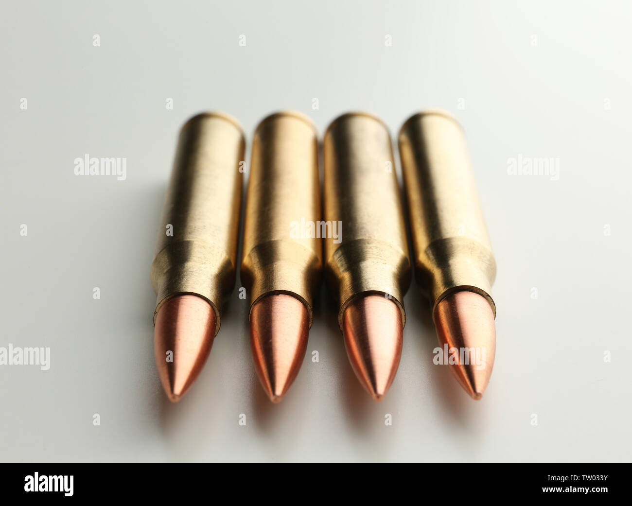 Rifle bullets on white background Stock Photo - Alamy