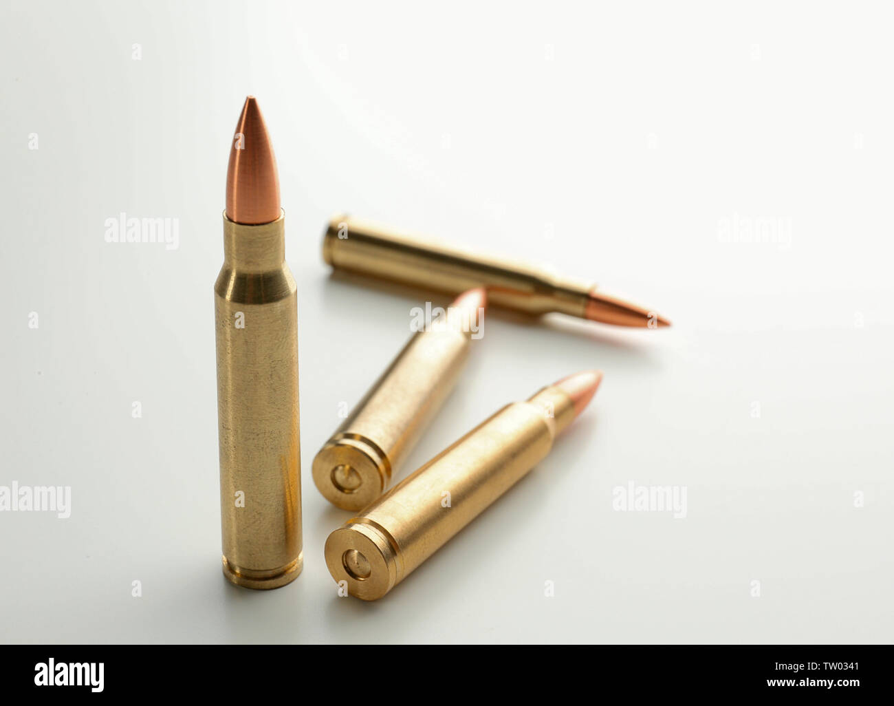 Rifle bullets on white background Stock Photo - Alamy