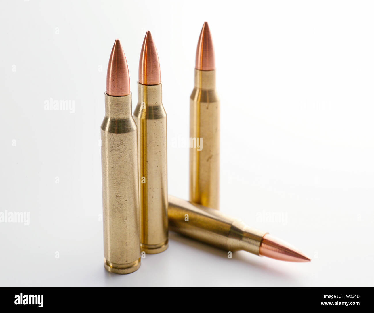 Rifle bullets on white background Stock Photo - Alamy
