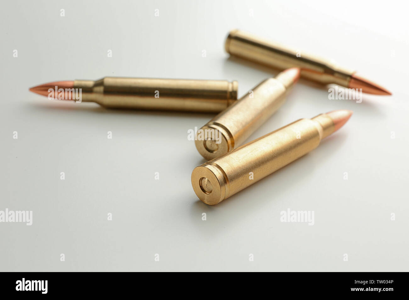 Rifle bullets on white background Stock Photo - Alamy