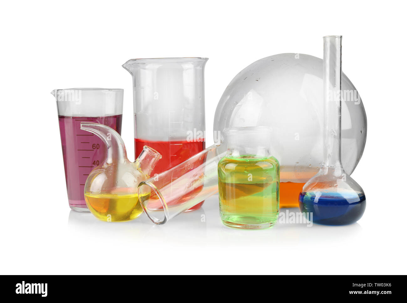 Different chemical glassware with color water on white background Stock ...