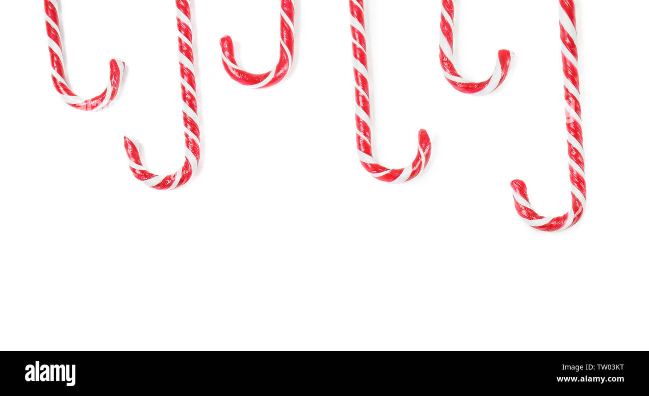 Candy canes on white background Stock Photo - Alamy