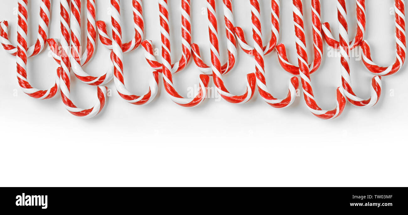 Candy canes on white background Stock Photo - Alamy