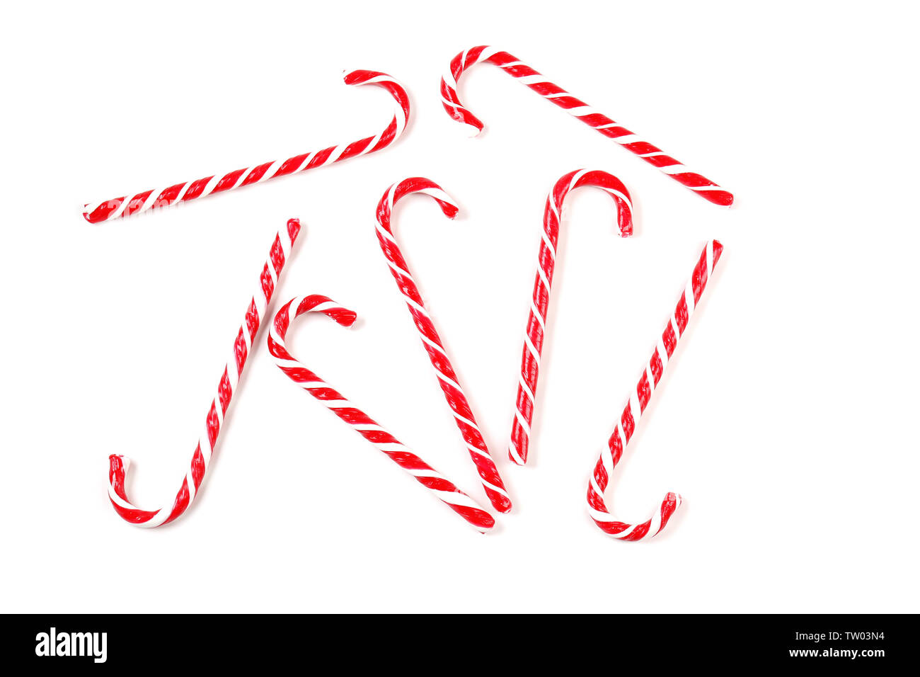 Candy canes on white background Stock Photo - Alamy