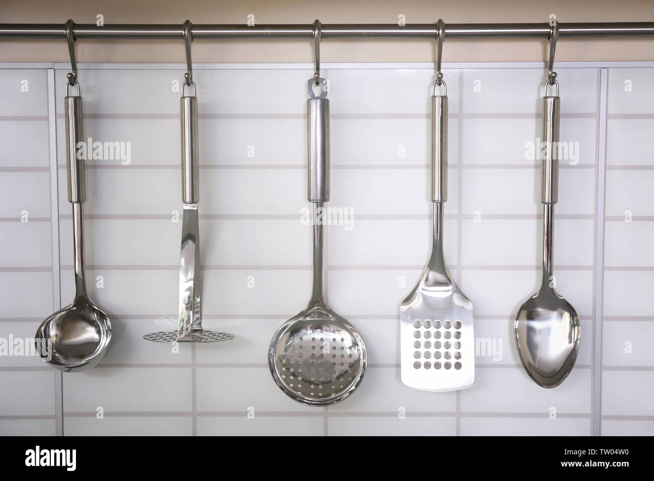 Set of utensils on kitchen Stock Photo - Alamy
