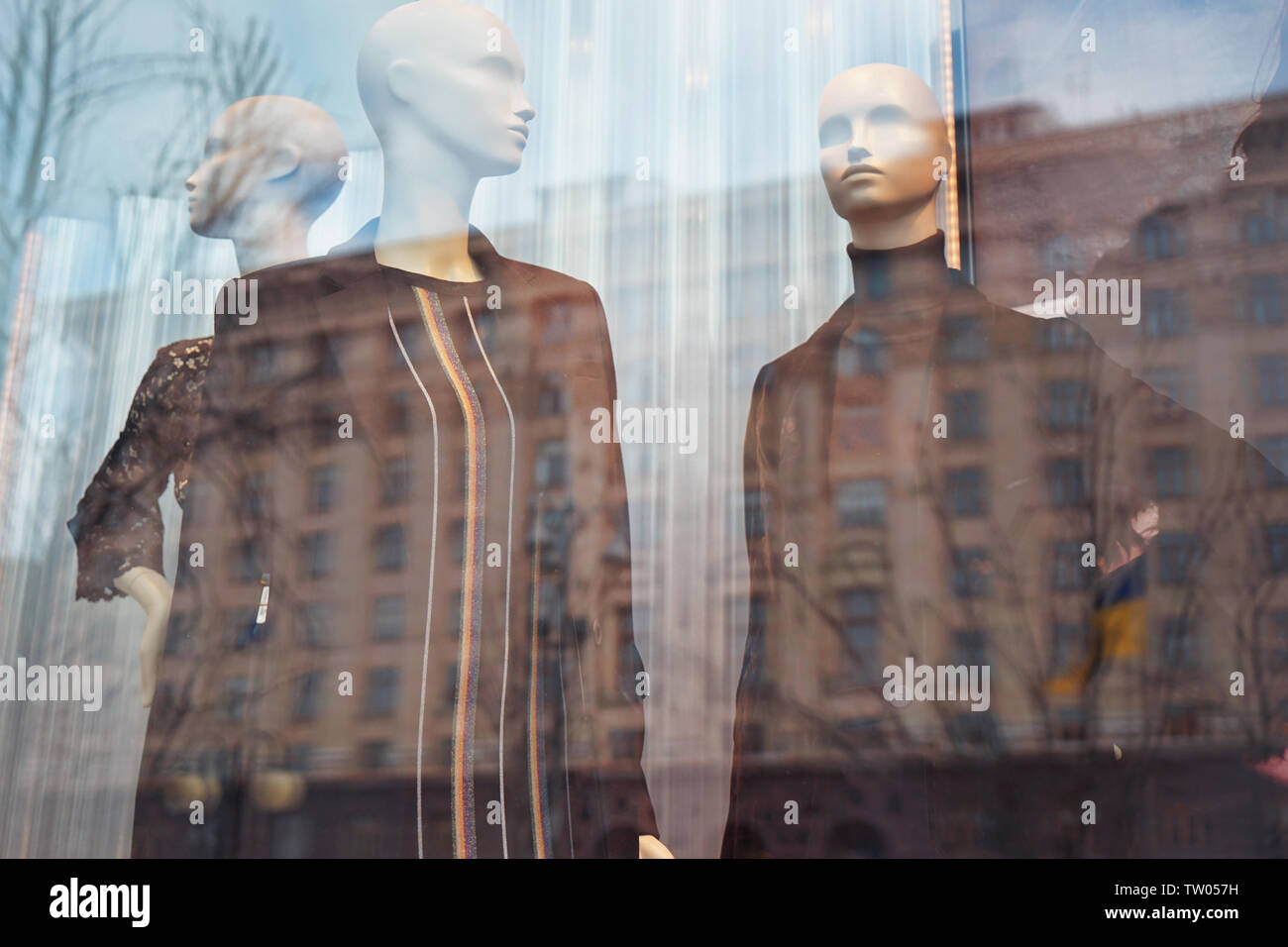 Mannequins in shop window Stock Photo - Alamy
