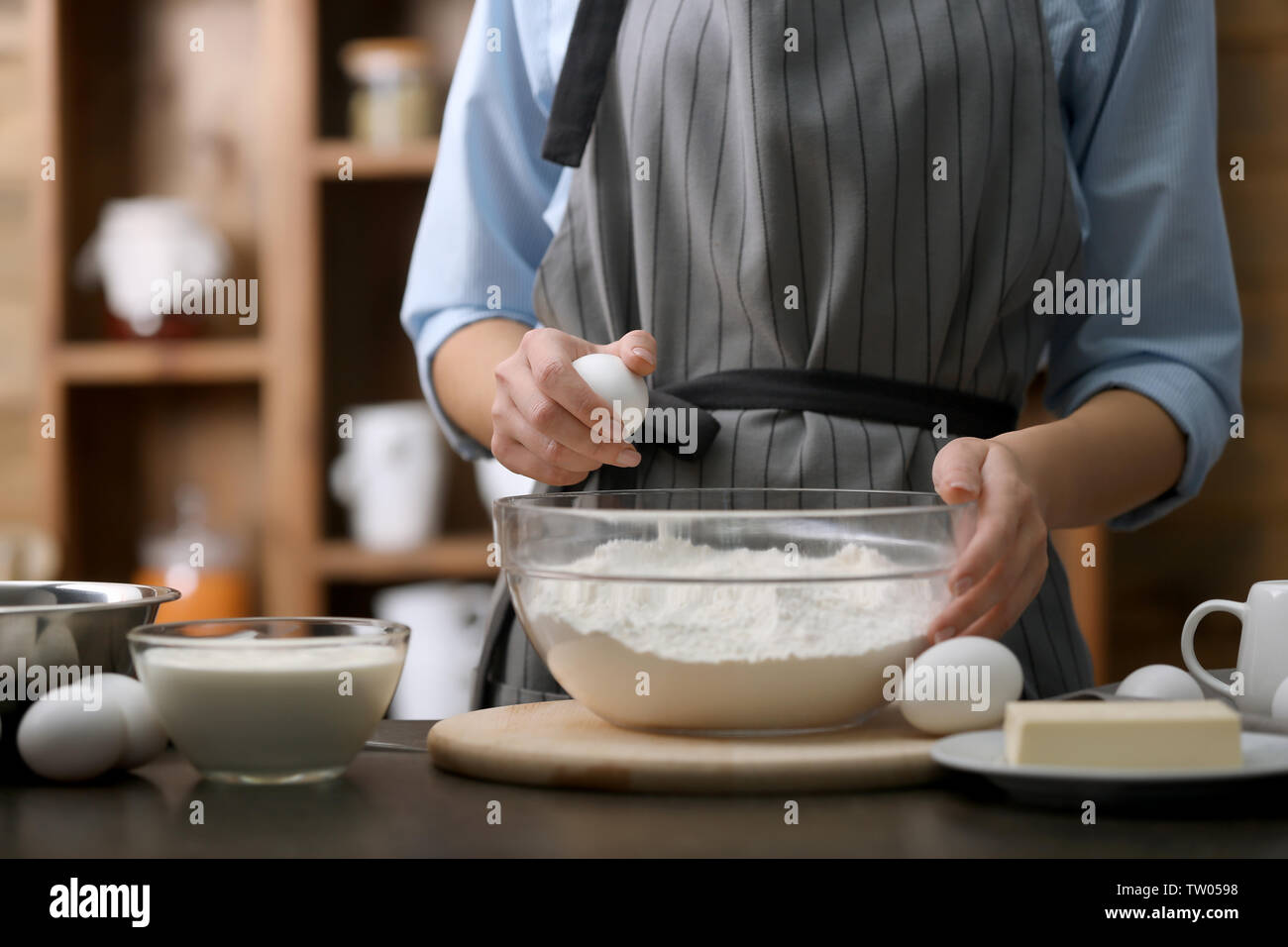 Cooking concept. Woman making dough on kitchen Stock Photo - Alamy