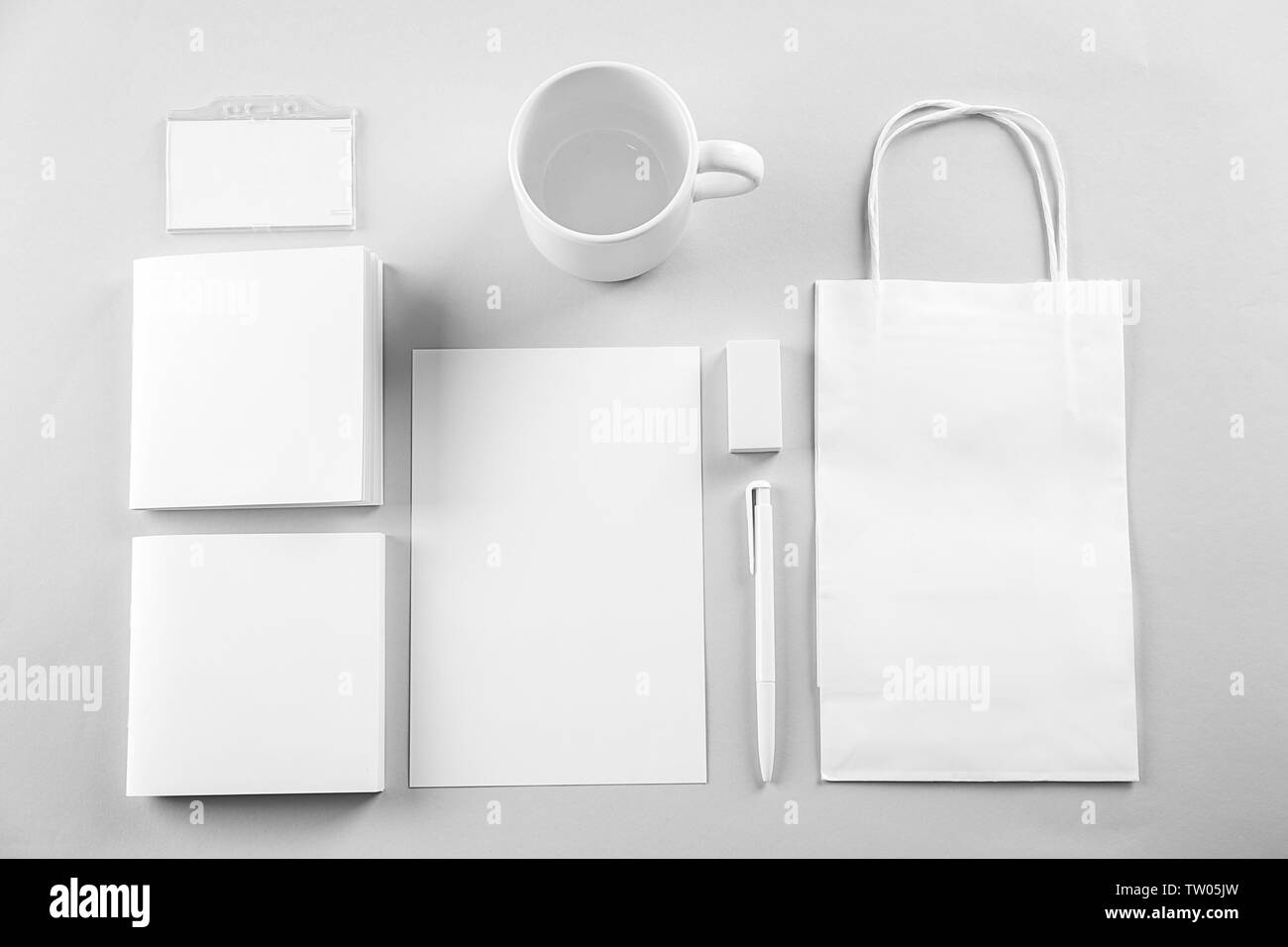 Set of blank items for branding on light background Stock Photo - Alamy