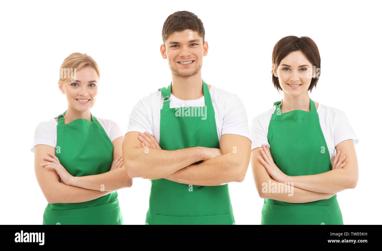 Cleaning staff in green aprons on white background Stock Photo - Alamy