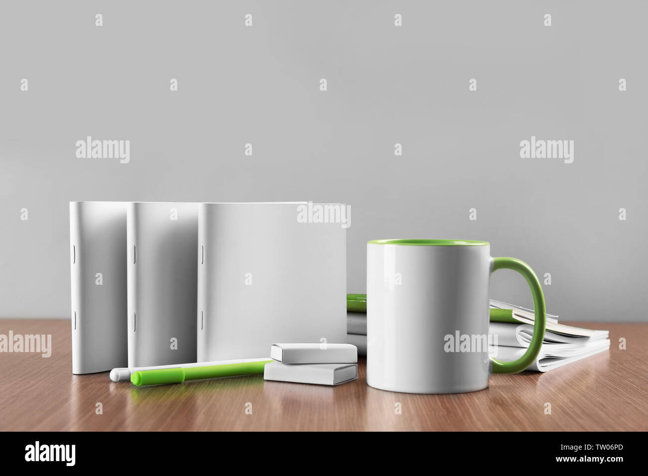 Blank goods on wooden table and grey background Stock Photo - Alamy