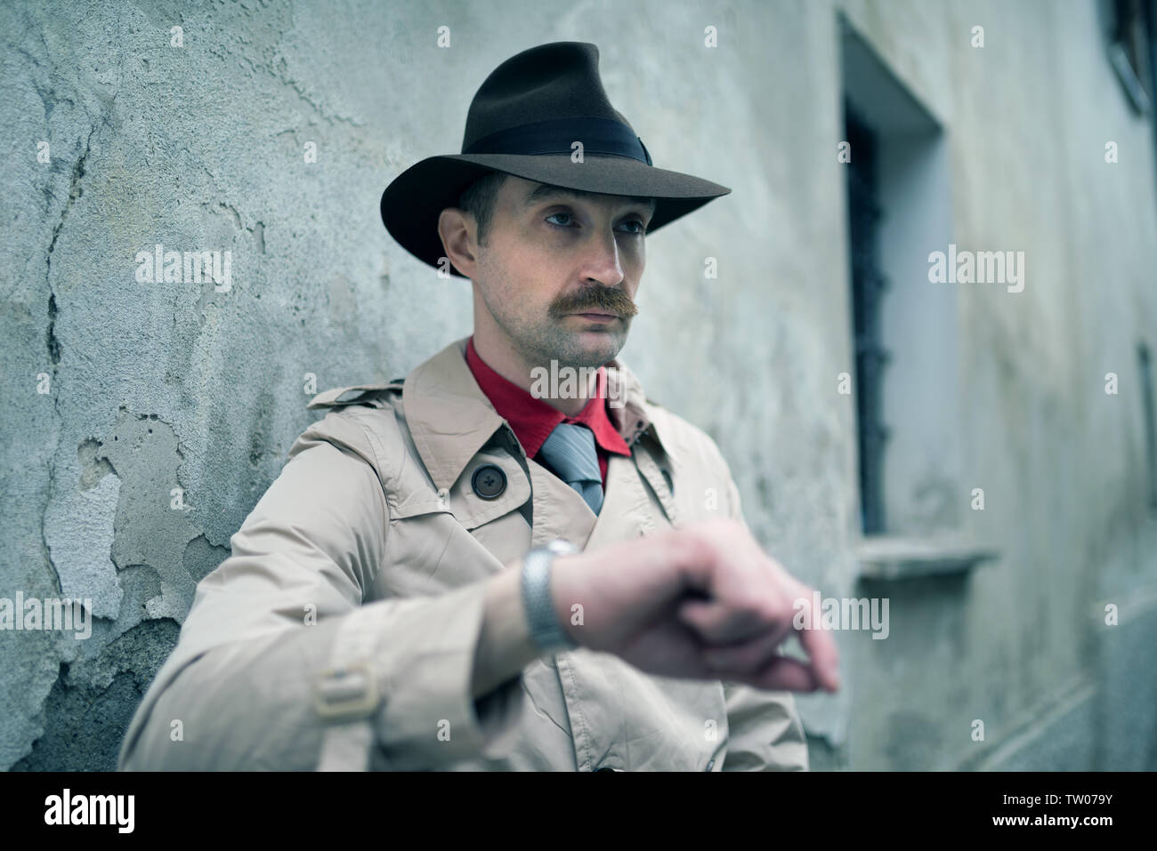 Secret agent waiting for an appointment in a skid row Stock Photo - Alamy