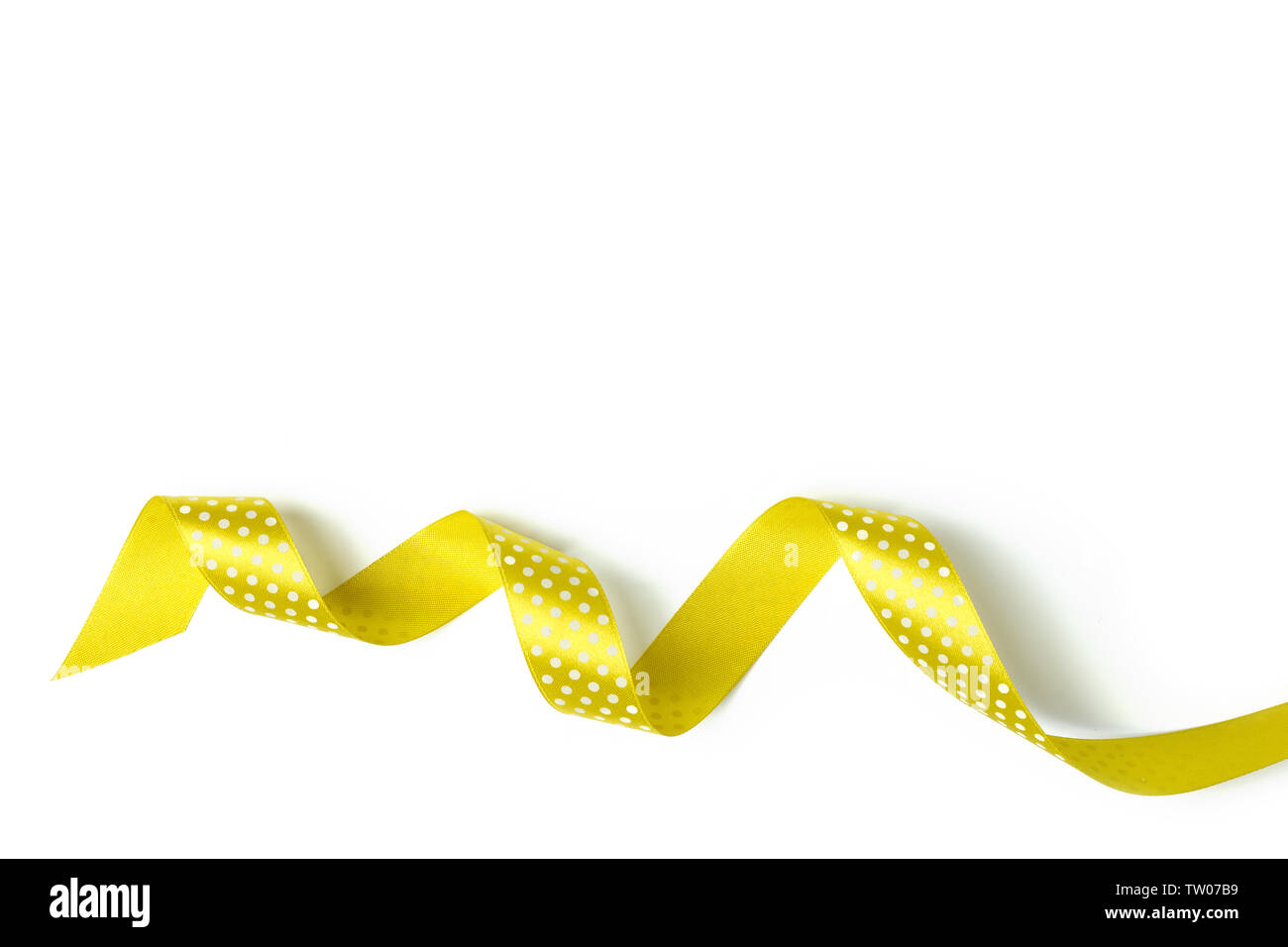 Yellow ribbons isolated on white Stock Photo - Alamy
