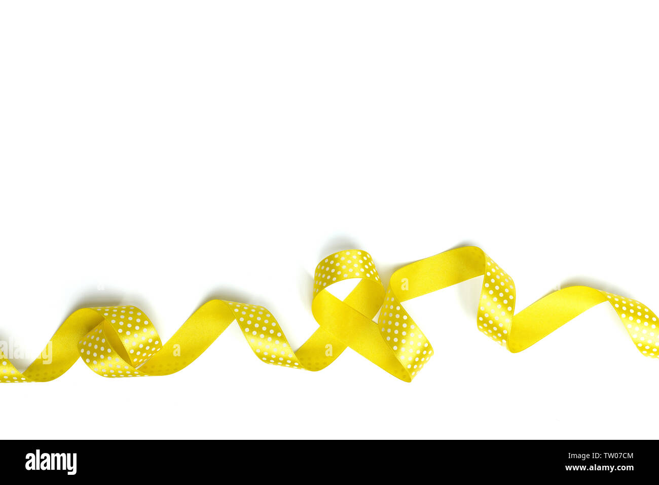 Yellow ribbons isolated on white Stock Photo - Alamy
