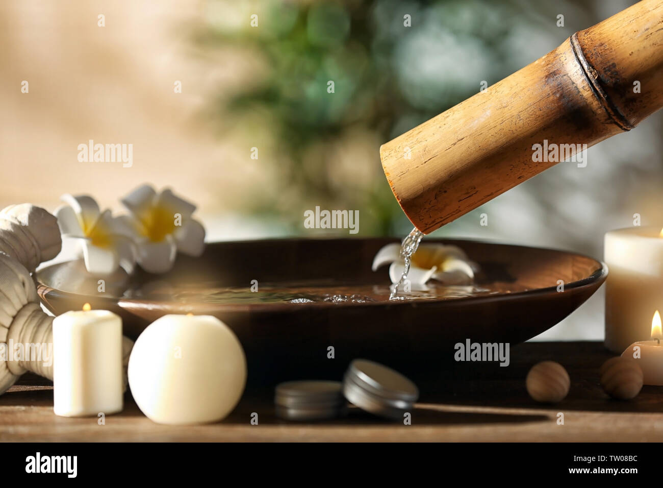 Beautiful spa composition with pouring water Stock Photo - Alamy