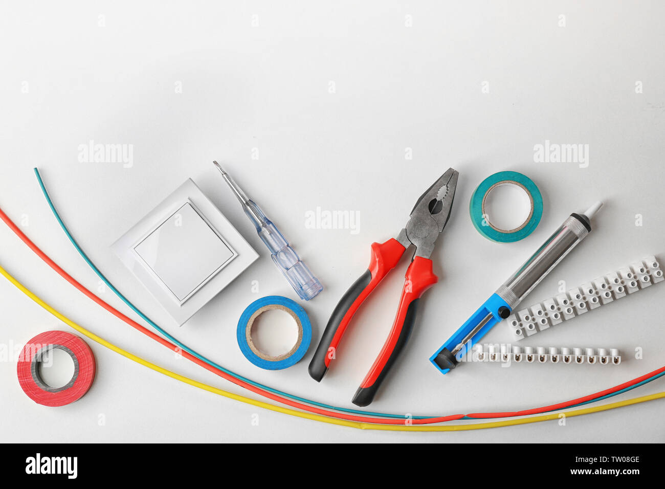Different electrical tools on white background Stock Photo - Alamy