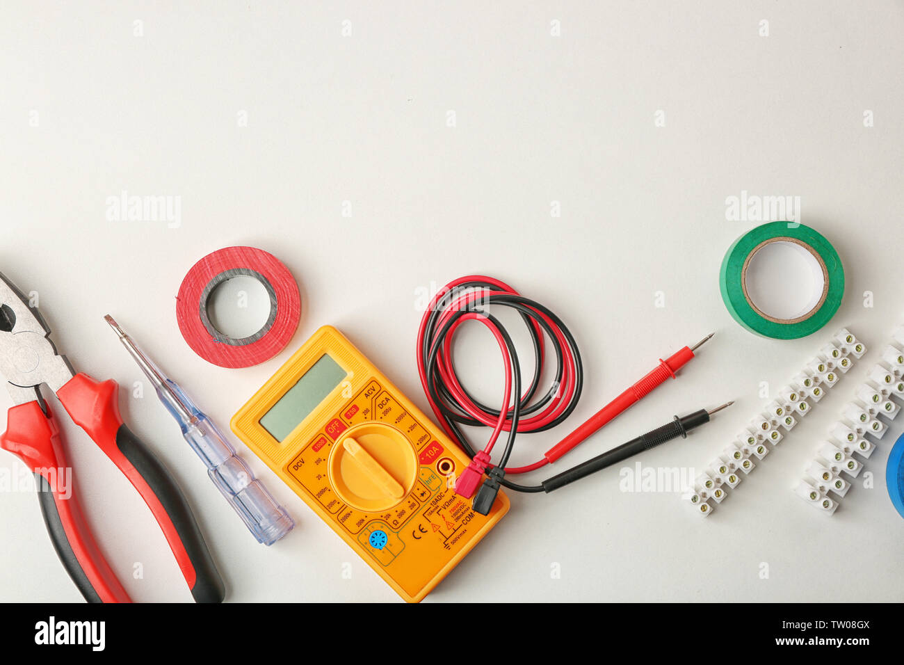 Different electrical tools on white background Stock Photo - Alamy