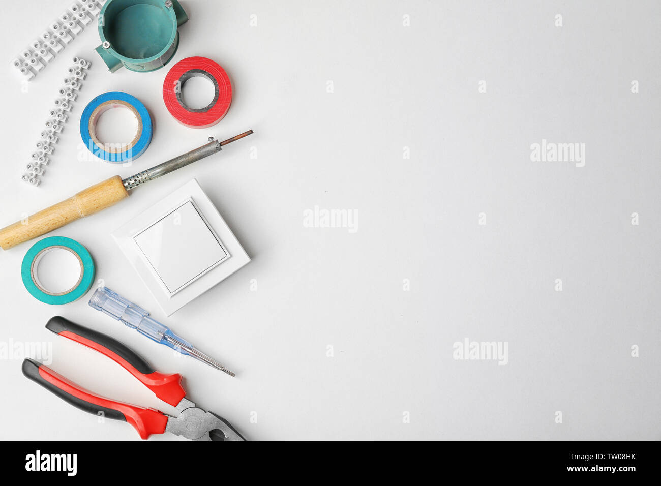 Different electrical tools on white background Stock Photo - Alamy