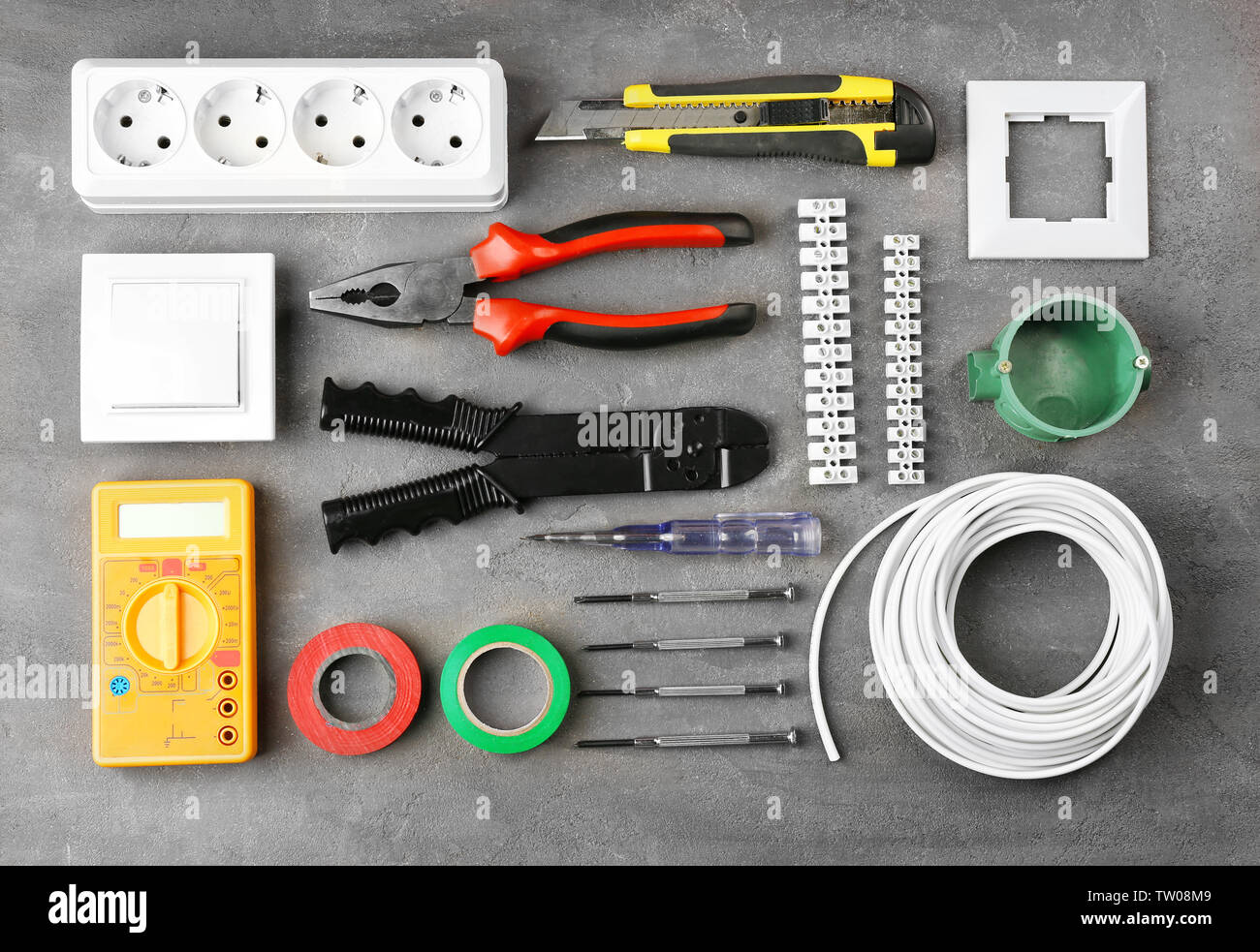 Different electrical tools on grey background Stock Photo - Alamy