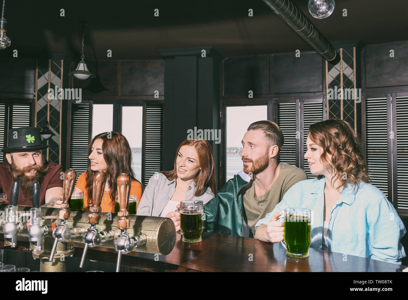 People celebrating Saint Patrick's Day in pub Stock Photo - Alamy