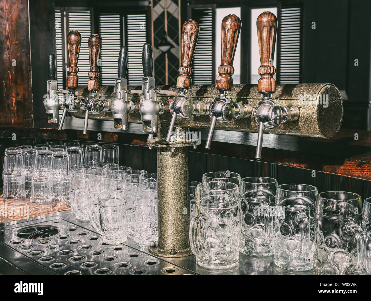 Draft beer taps in modern bar Stock Photo - Alamy