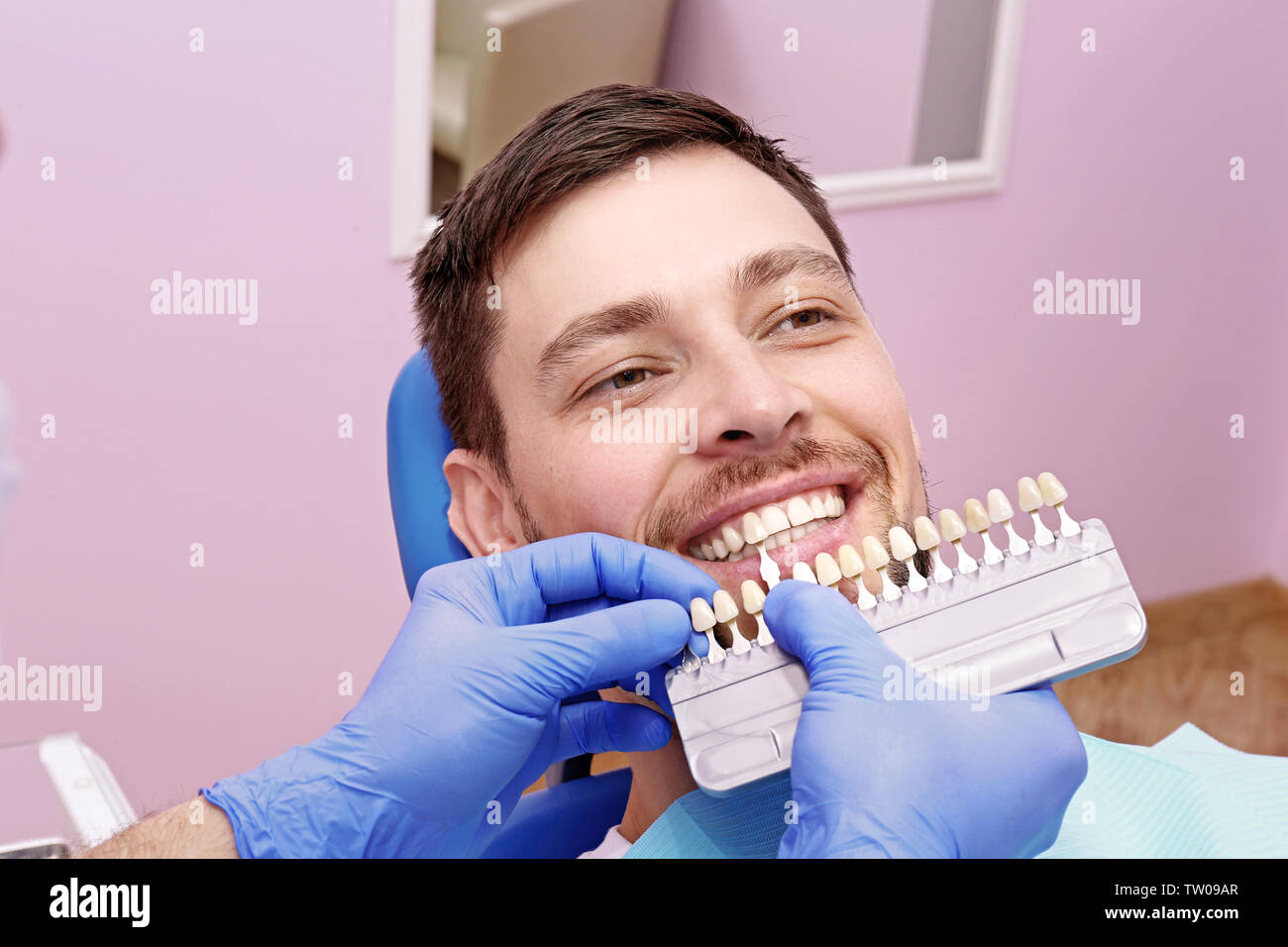 Male dentist comparing color hi-res stock photography and images - Alamy
