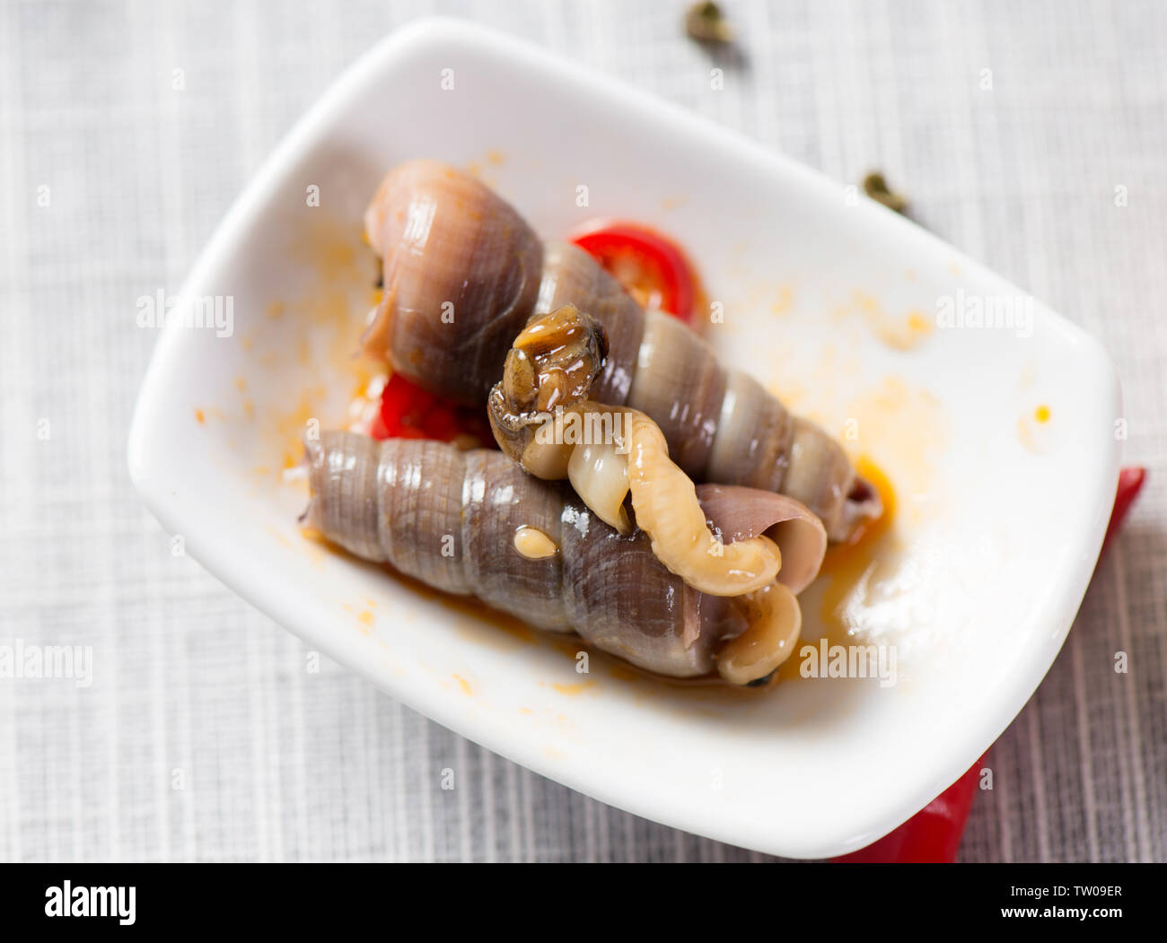 Spicy seafood snail Stock Photo - Alamy