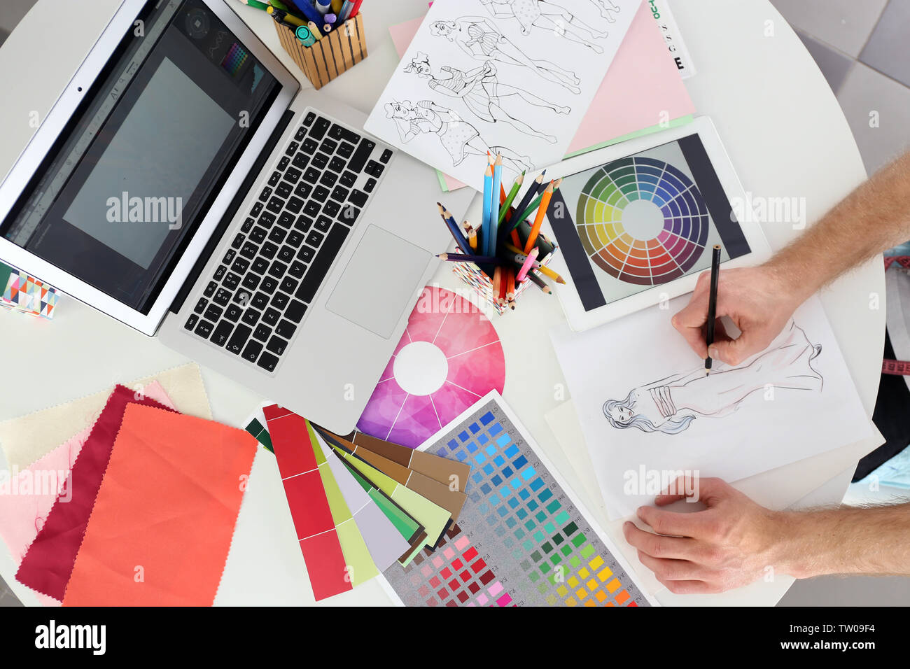 Closeup of fashion designer drawing at office Stock Photo - Alamy