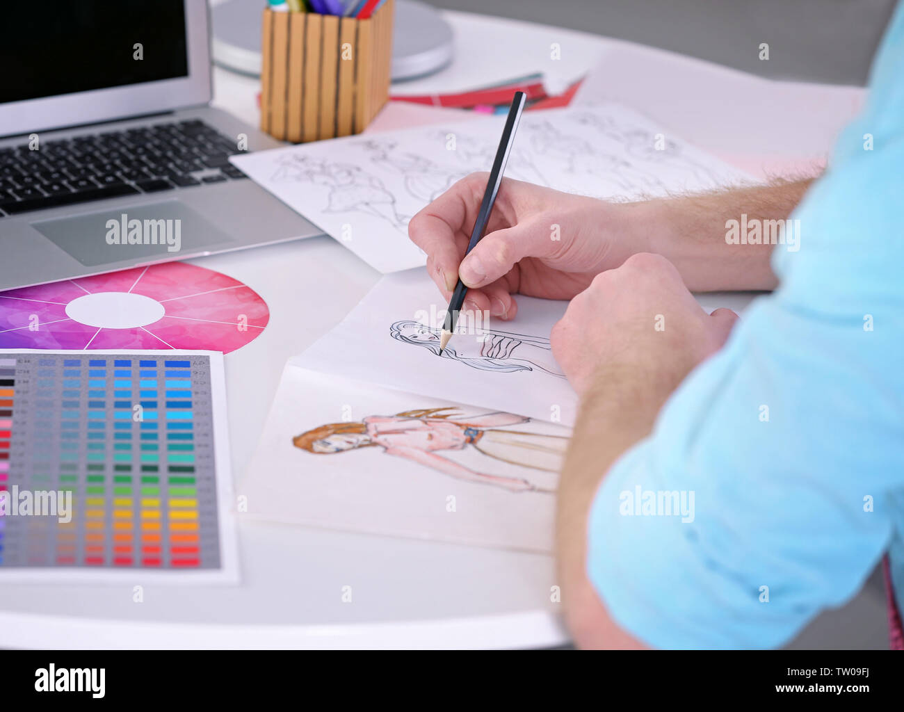 Closeup of fashion designer drawing at office Stock Photo - Alamy