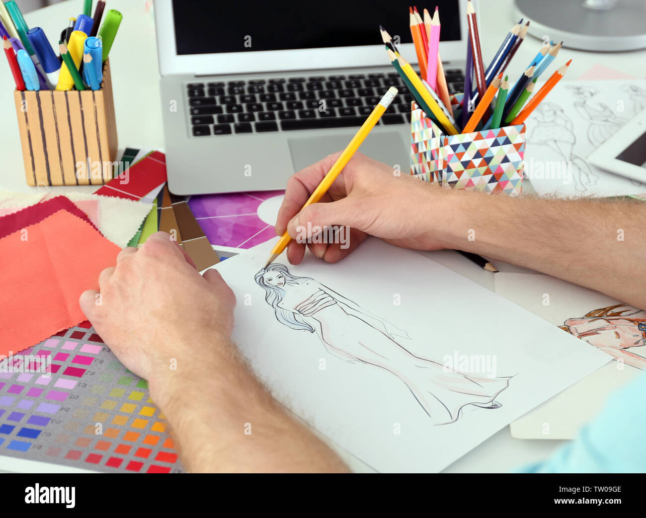 Closeup of fashion designer drawing at office Stock Photo - Alamy