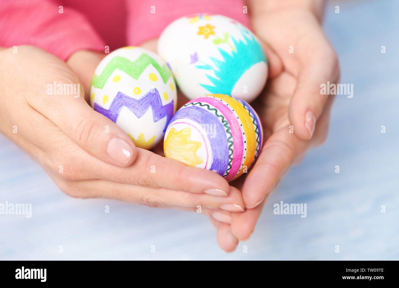 Mother and daughter holding decorated Easter eggs Stock Photo - Alamy