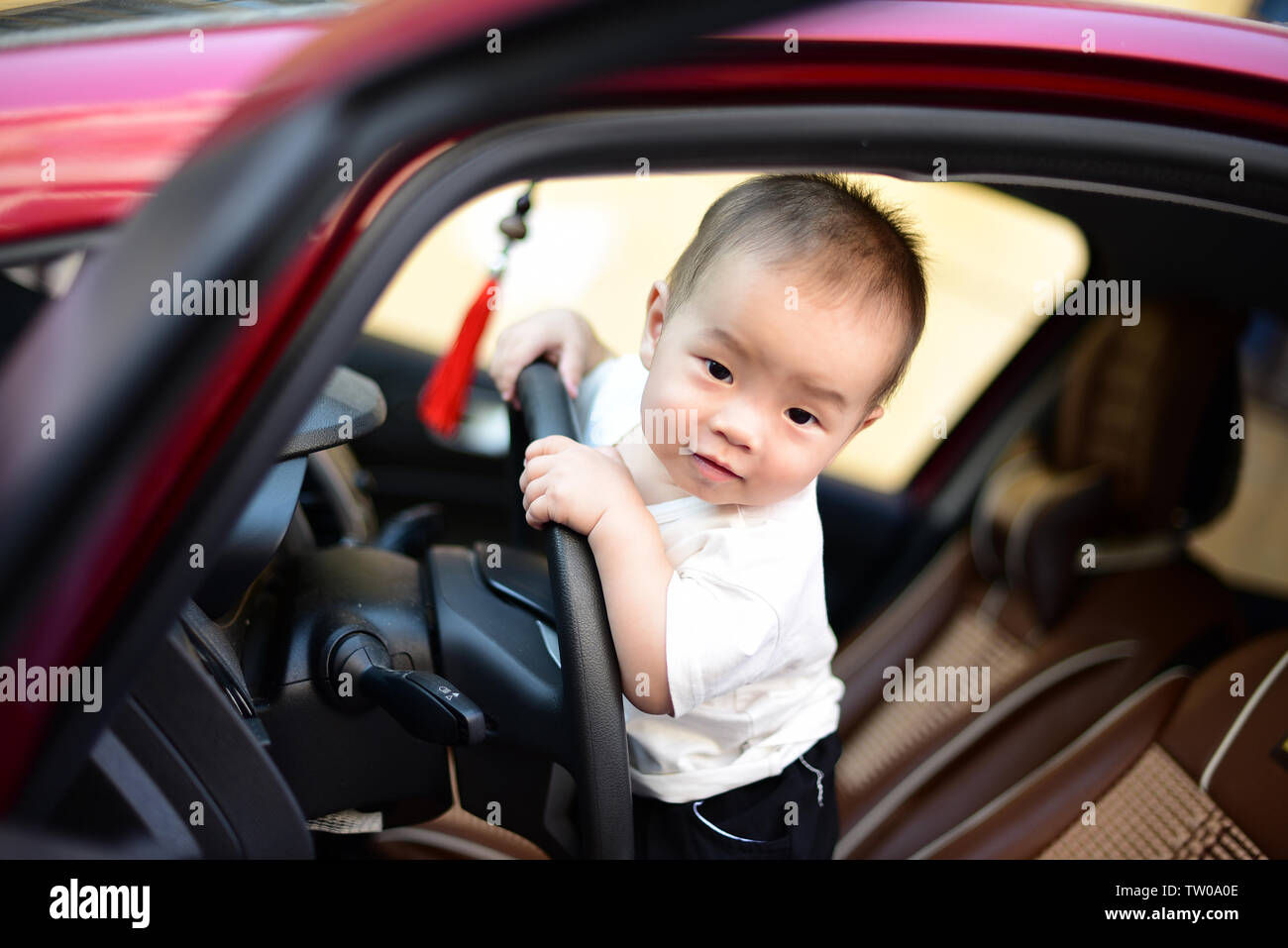 Baby drives a car Stock Photo - Alamy