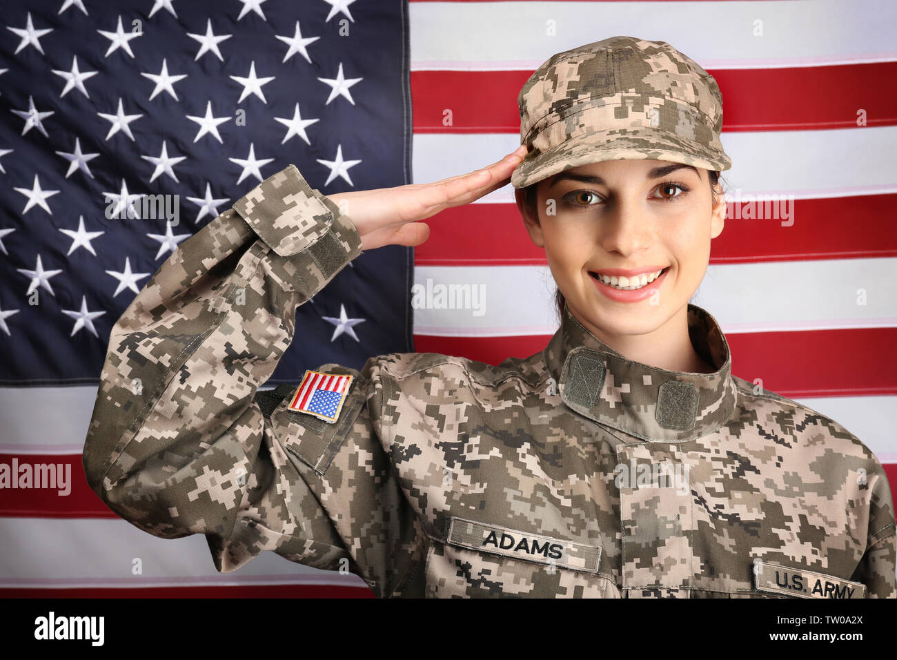 American female soldier saluting flag hi-res stock photography and ...