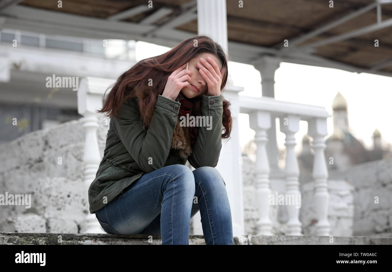 Woman crying stairs hi-res stock photography and images - Alamy